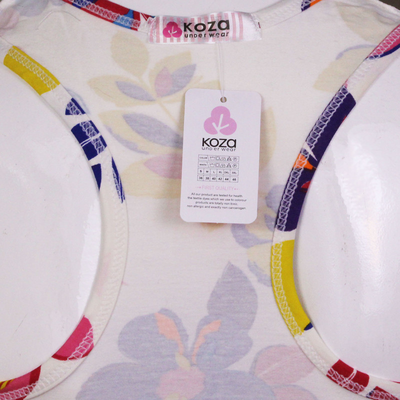 قیمت و خرید ست نیم تنه و شورت ورزشی زنانه کوزا مدل 9158-2 رنگ سفید